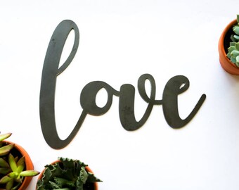 Cursive love sign | Etsy