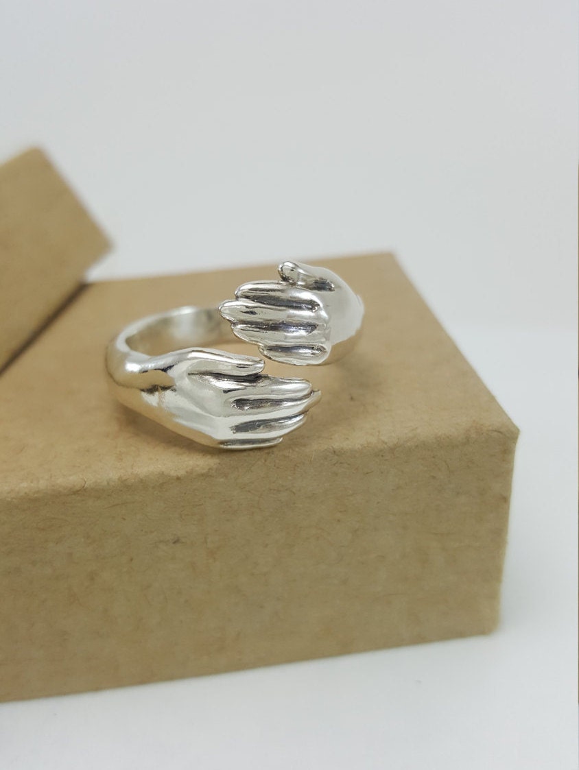 Hug Ring in Sterling Silver silver hug ring hugging hands