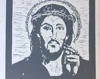 Linocut of a rabbit with a dandelion