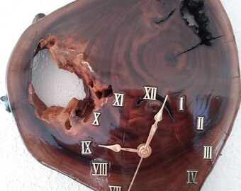 Walnut wall clock with a hand carved tree using natural