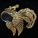 Items similar to Vintage Oval Japaned Metal Rhinestone Brooch on Etsy