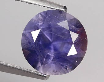 5mm faceted iolite gemstones. violet gems. brilliant cut.