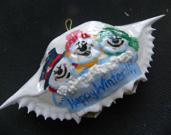 Santa Claus running his train full of toys painted crab shell