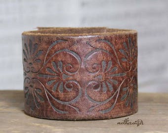 handstamped leather cuffs by mothercuffer on Etsy