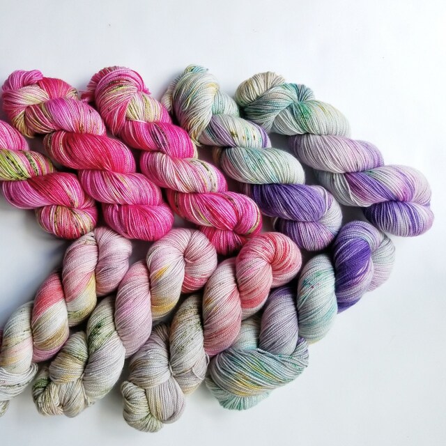 Hand dyed yarns in splashes of colors by WobbleGobble on Etsy