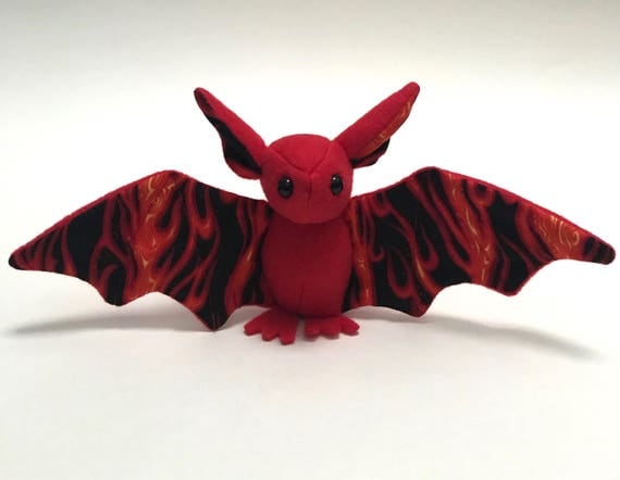 Small red bat with flames and fire print soft stuffed plush