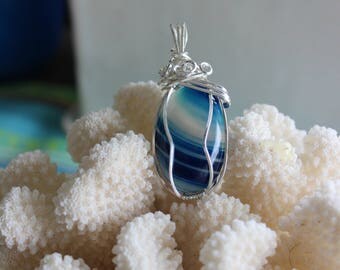 Items similar to Coral Agate wrapped in Silver wire on Etsy