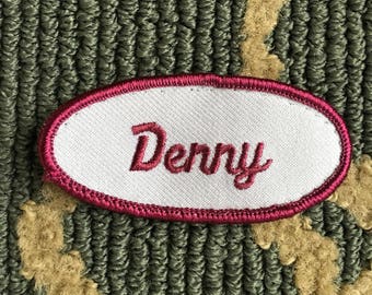 Zack. A yellow work shirt patch that says Zack in