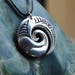 Sterling Silver Koru Wave Pendant connections with the