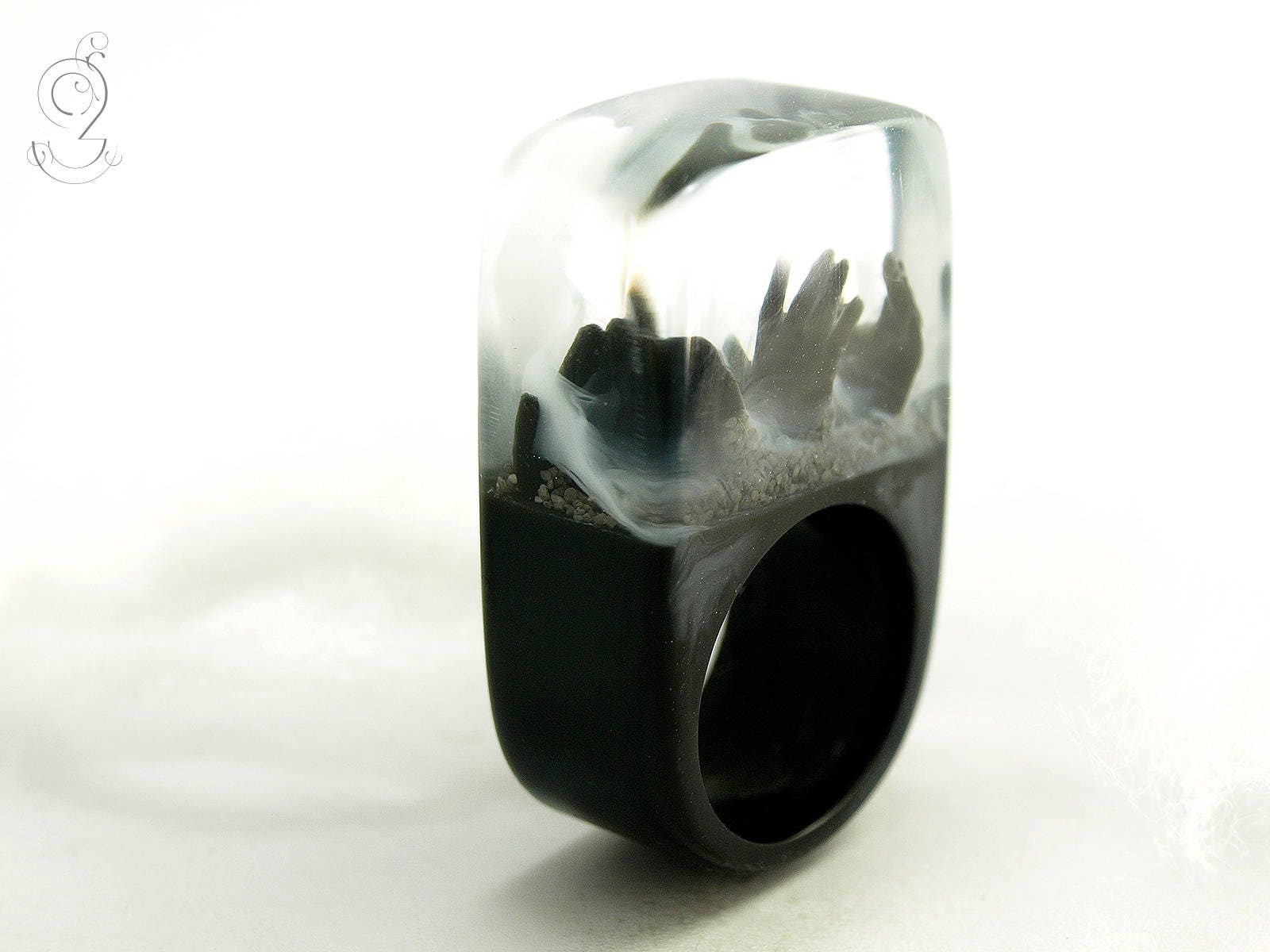 Zombie creepy undead ring with three black hands and fog on